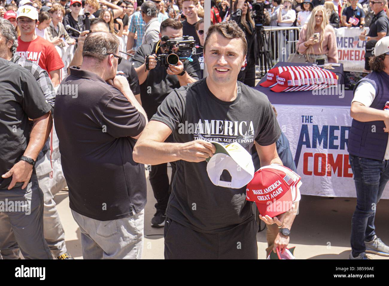 Charlie Kirk, founder of Turning Point USA, throws hats to the public ...