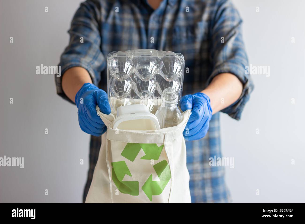 man handing out a recycling bag Stock Photo - Alamy