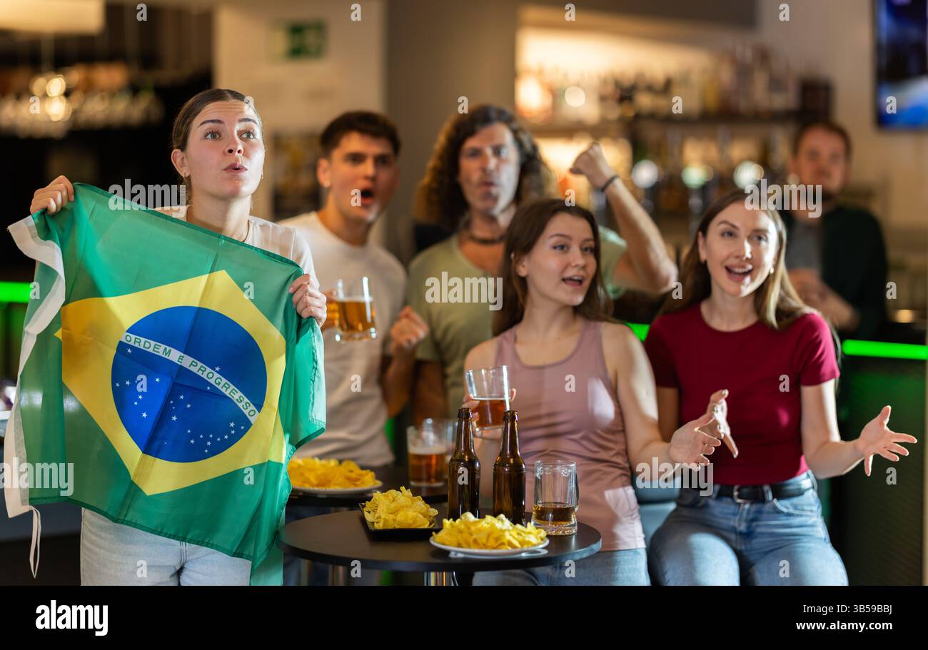 Group of fans in bar with Brazilian flag Stock Photo - Alamy
