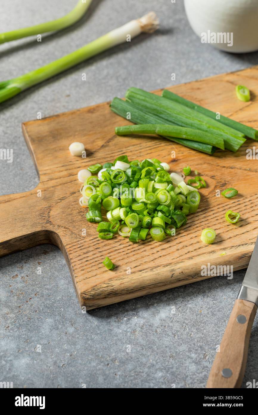 Green Organic Cut Green Onion Scallions on a Cutting Board Stock Photo ...