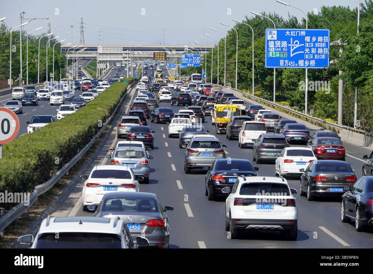BEIJING, CHINA - MAY 1, 2025 - Vehicles are moving slowly on the ...