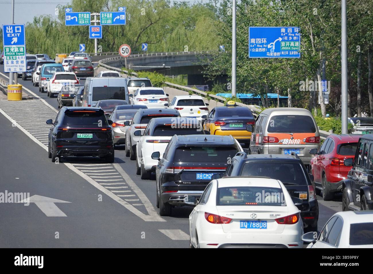 BEIJING, CHINA - MAY 1, 2025 - Vehicles are moving slowly on the ...