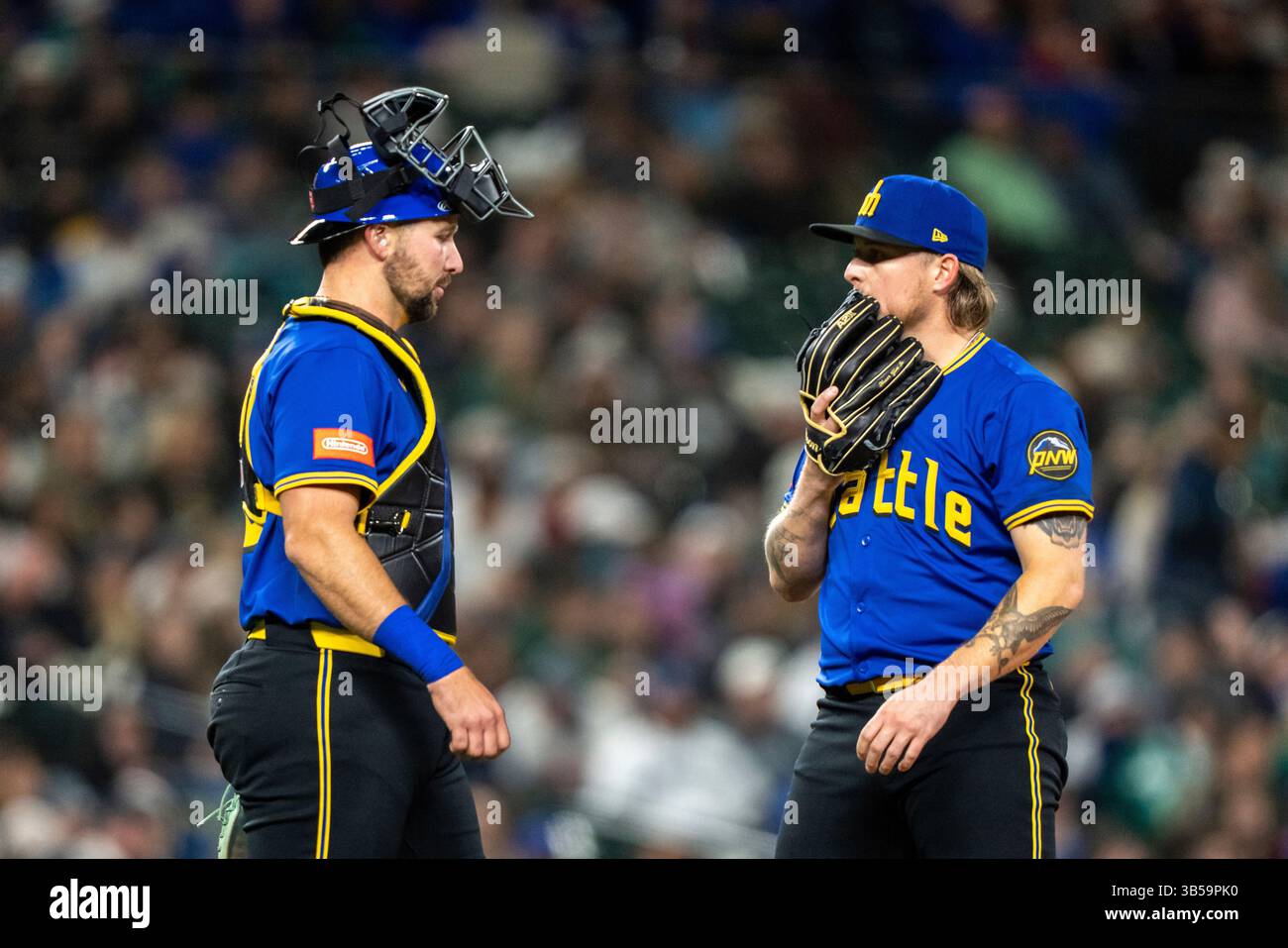 Seattle Mariners catcher Cal Raleigh, left, and relief pitcher Gabe ...