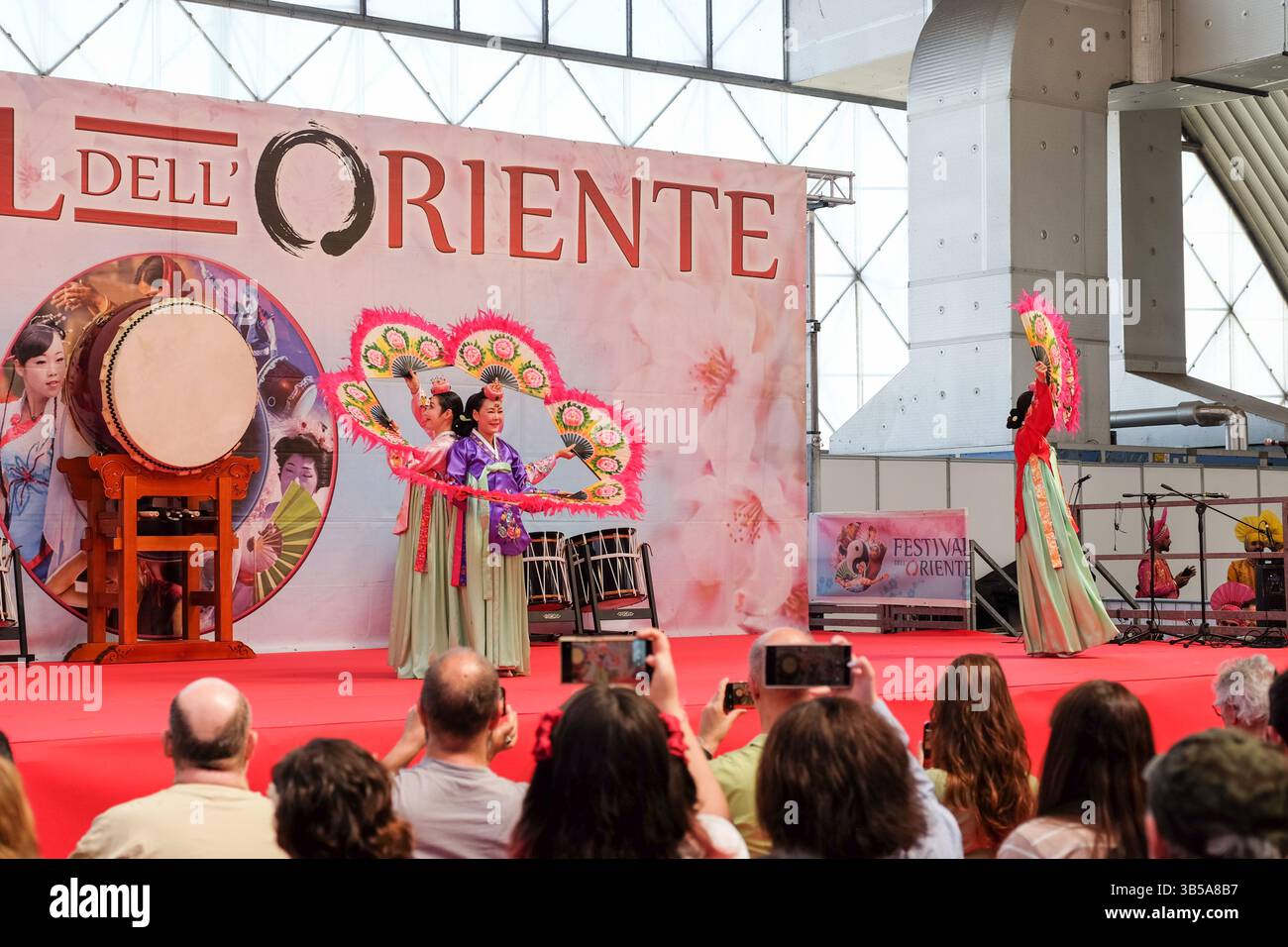 Milan, Italy. 1 May, 2025. Korean dancers perform the traditional fan ...