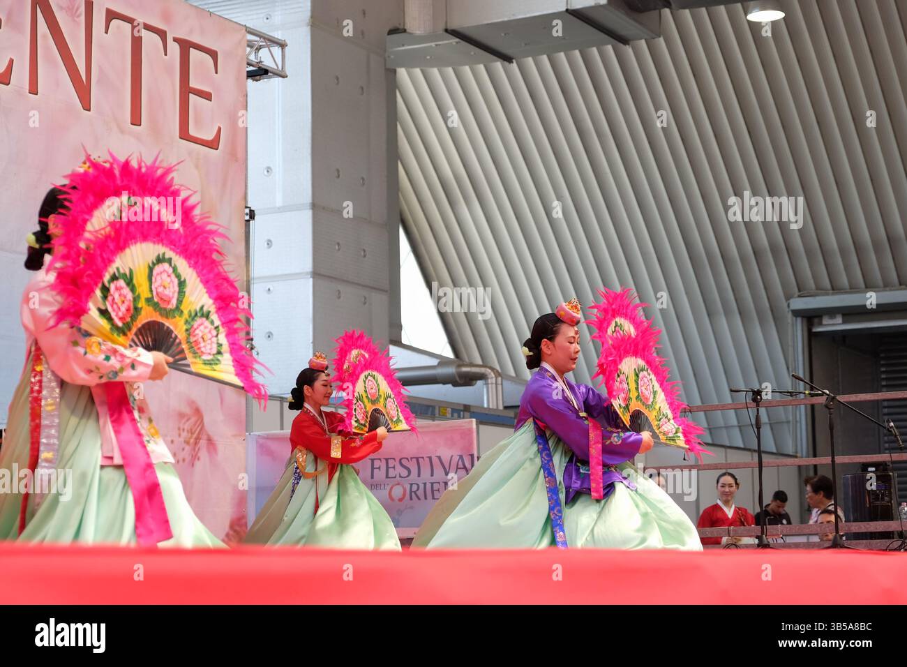 Milan, Italy. 1 May, 2025. Korean dancers in traditional hanbok perform ...