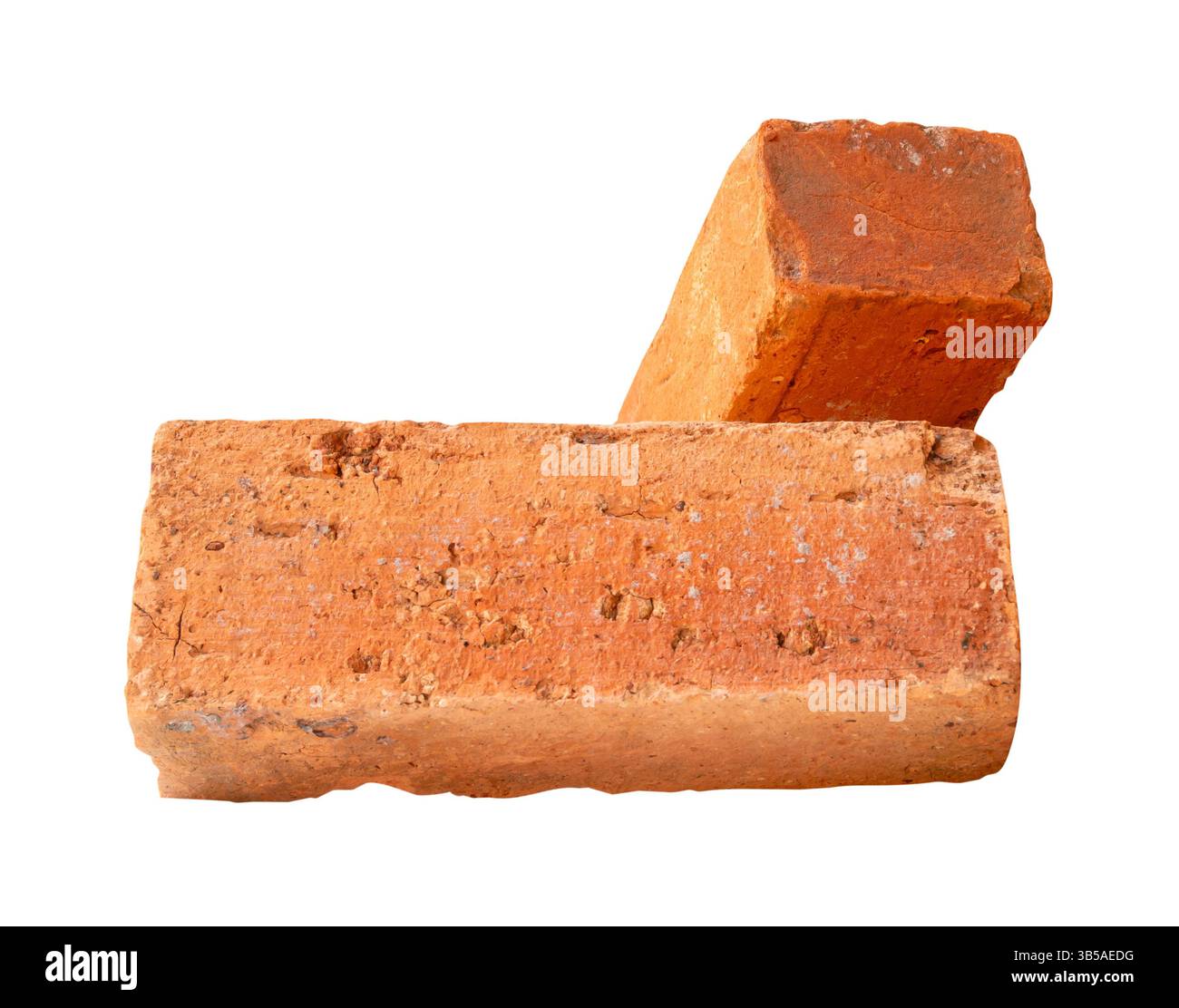 Side view of two old red or orange bricks is isolated on white ...