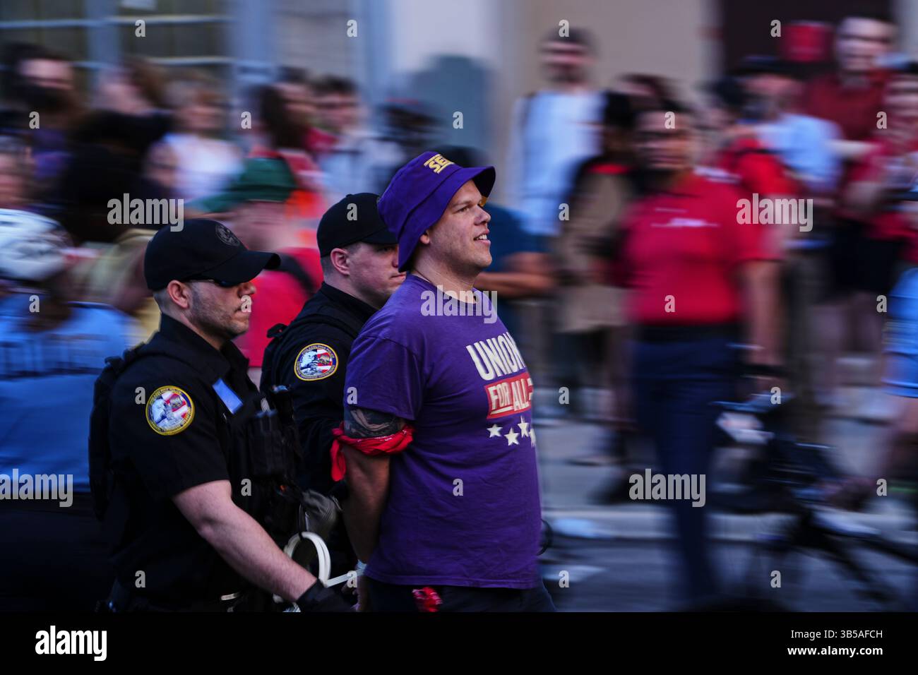 Demonstrators are detained during a May Day rally in Philadelphia ...