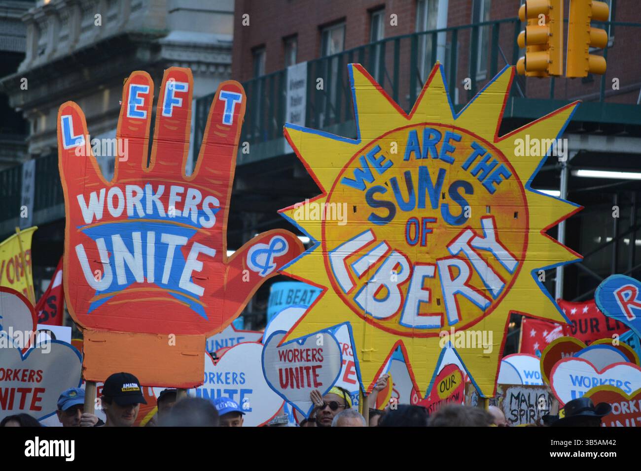 May Day demonstration supporting workers' rights and against the Trump ...