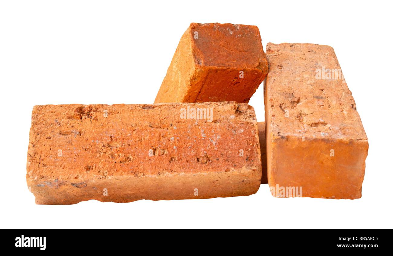Side view of three old red or orange bricks in stack is isolated on ...