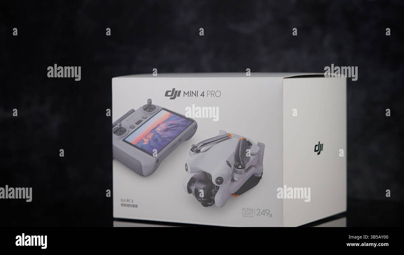 DJI Mini 4 Pro drone box featuring remote controller and folded drone ...