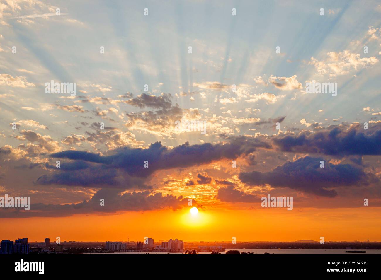 Miami beach sun clouds jgjg rays hi-res stock photography and images ...