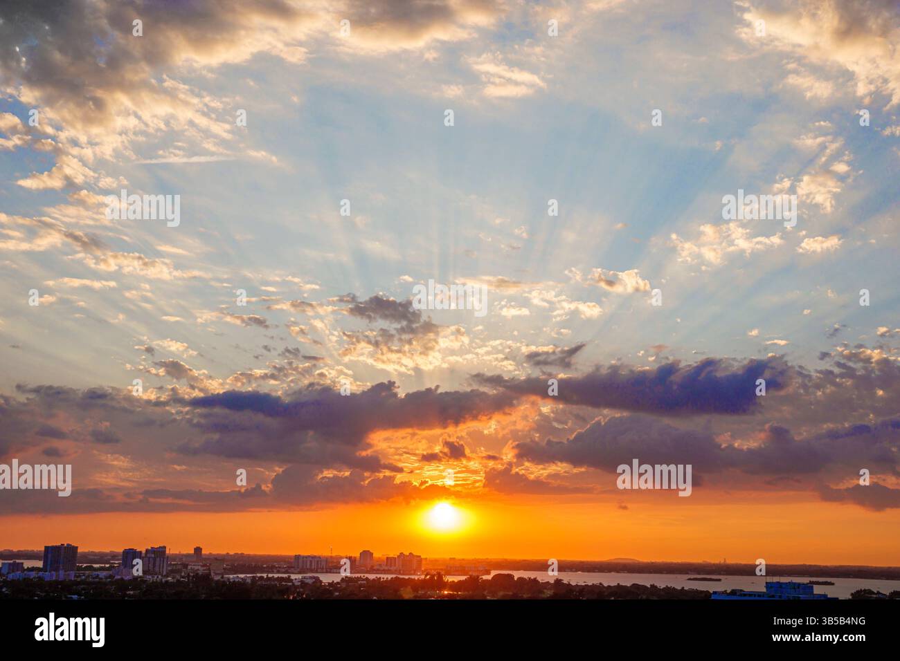 Miami beach sun clouds jgjg rays hi-res stock photography and images ...