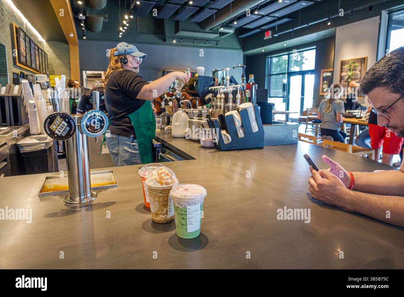 Davenport Florida,Starbucks Coffee,inside interior counter,woman ...