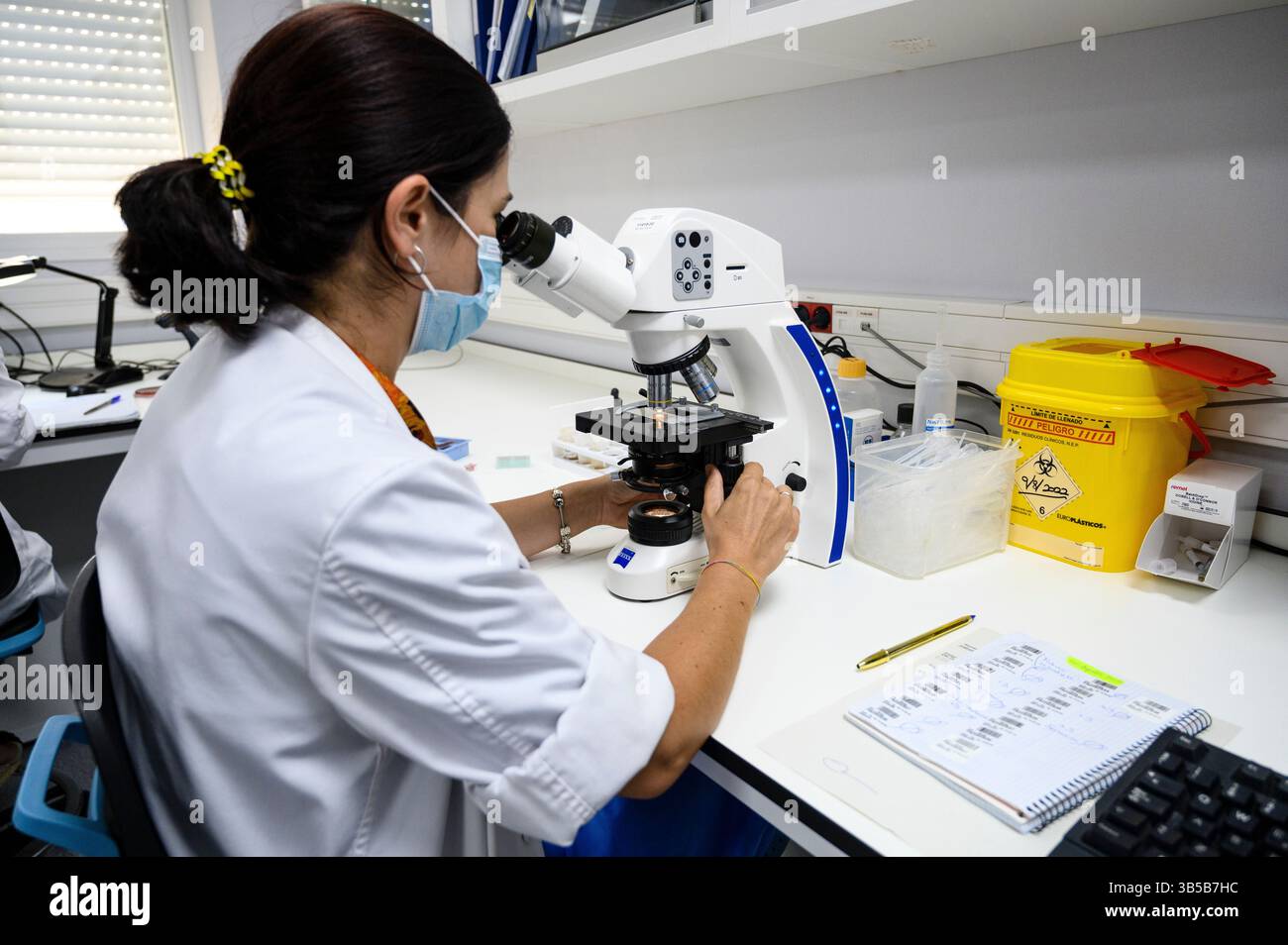 August 10, 2022, Seville, Andalusia, Spain: A lab technician looks a ...