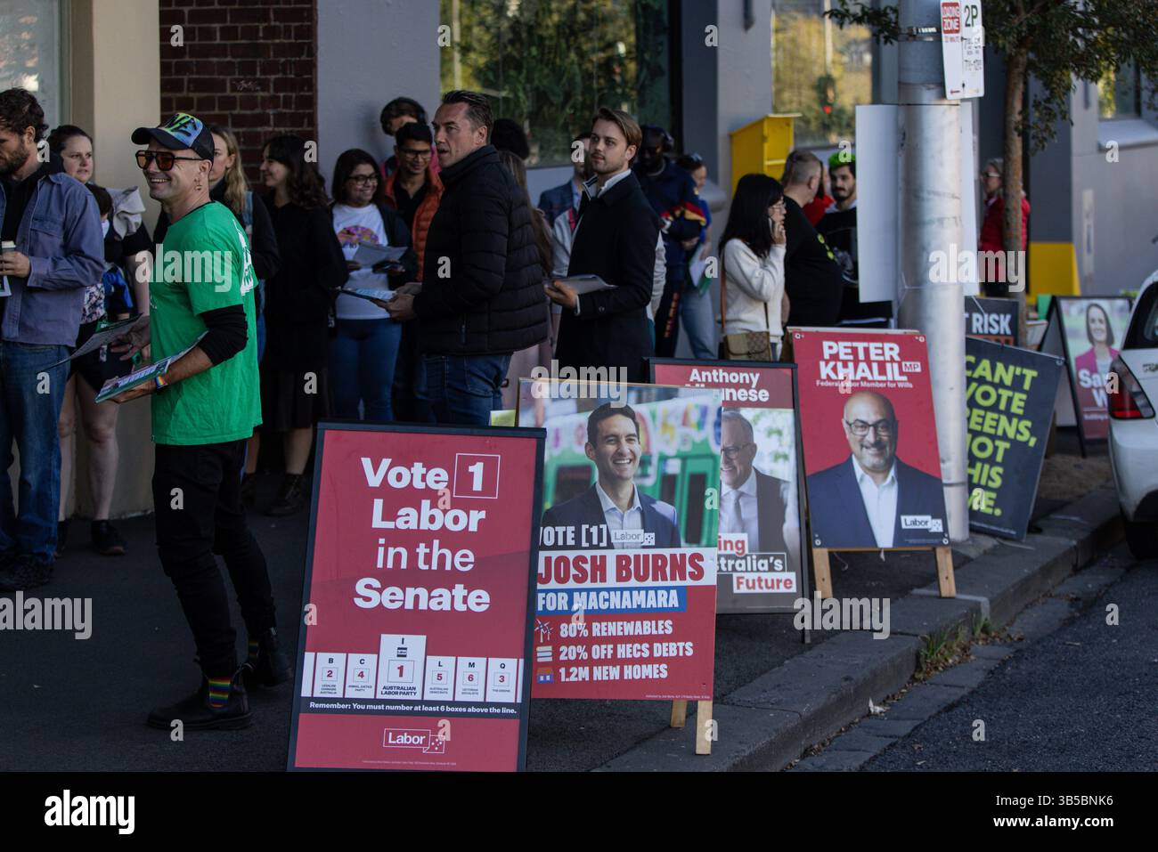 People line up ahead of casting their vote at an early voting centre in ...