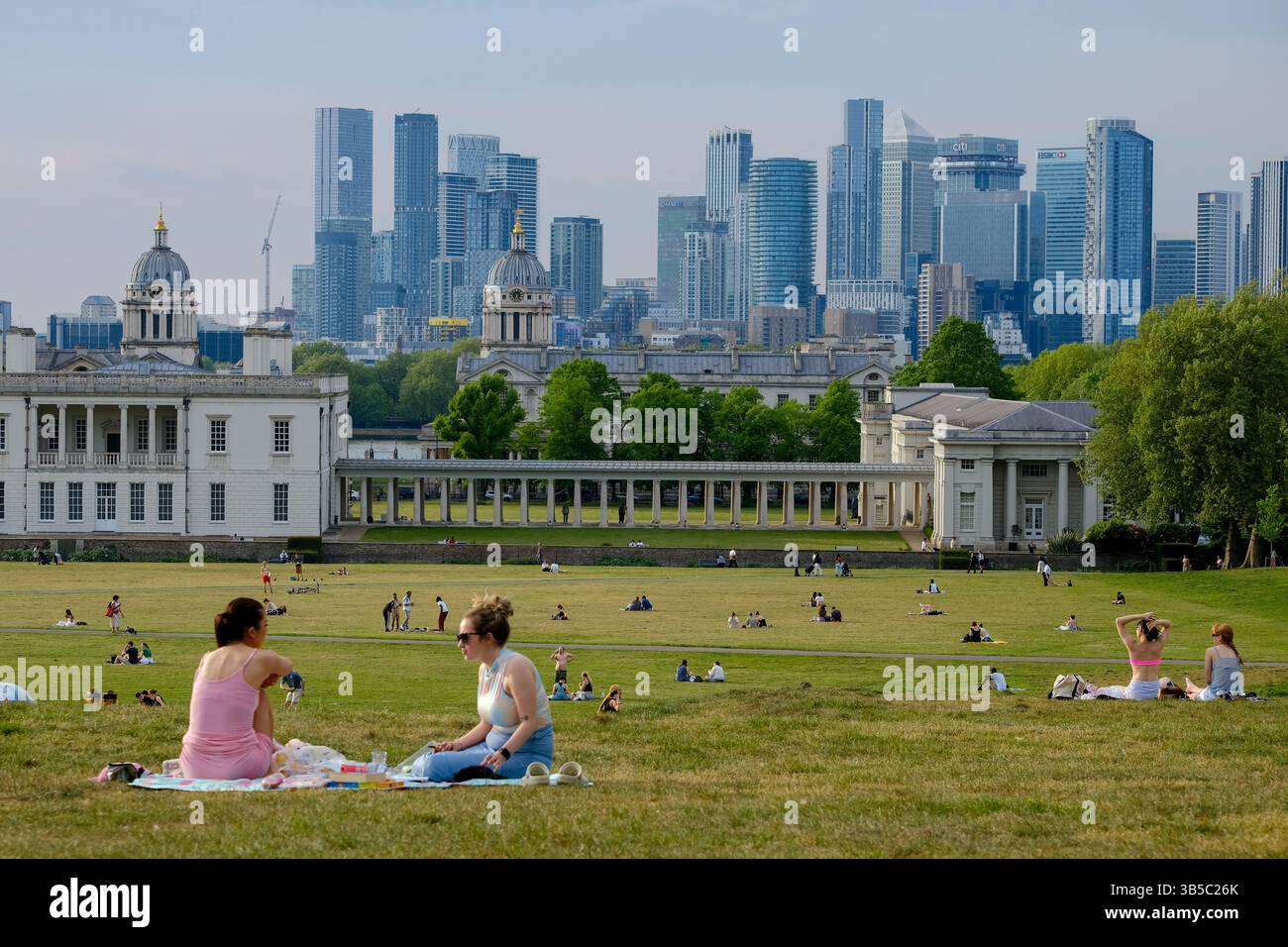 Picnickers enjoy the hot weather in Greenwich Park with the Canary ...