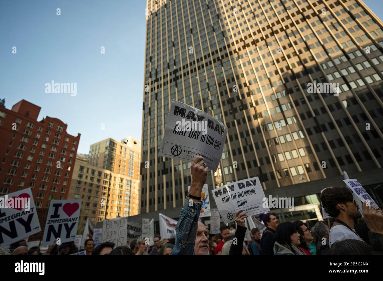 New York, United States. 1st May, 2025. Person holds "May Day is our ...