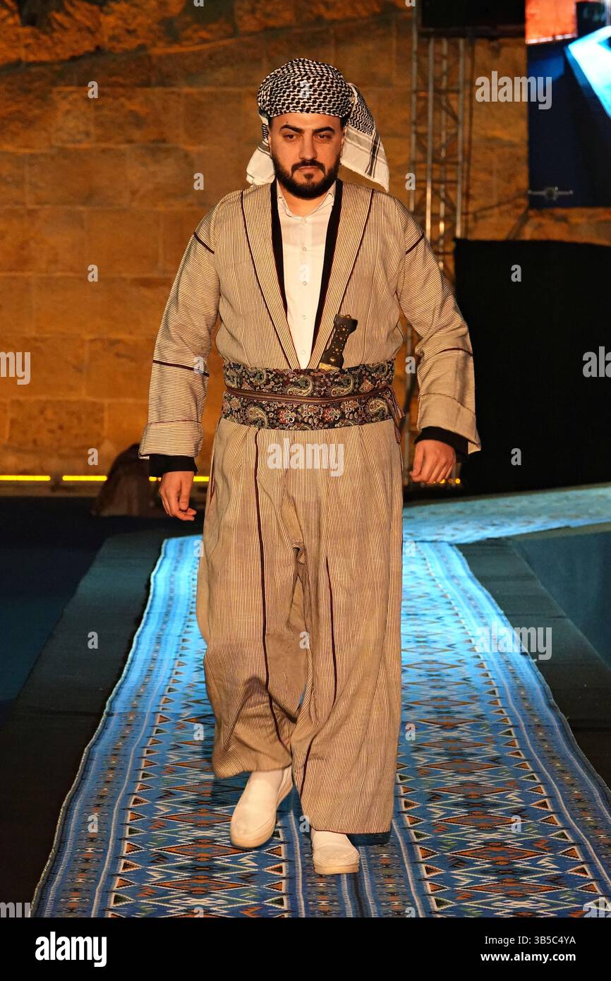 A Kurdish teenager is seen displaying a garment called Shal u Shapik ...