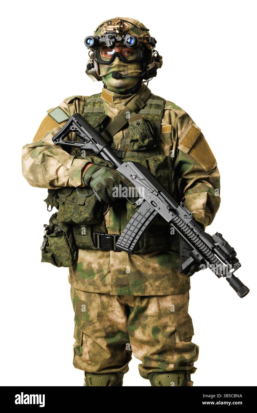 Soldier in camouflage uniform, armed with a rifle, wearing protective ...