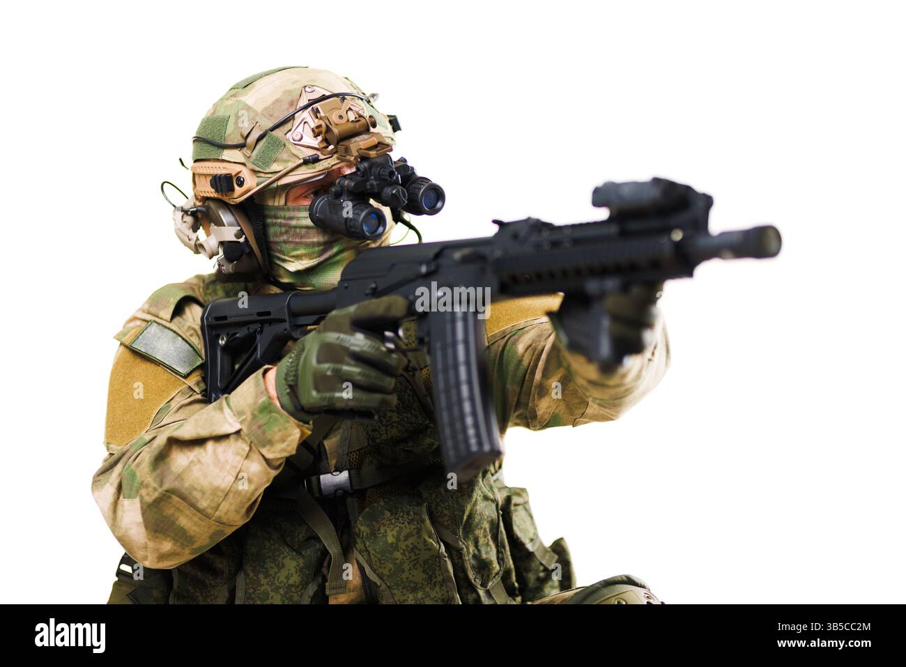 Armed military personnel in full disguise aiming tactical rifle with ...