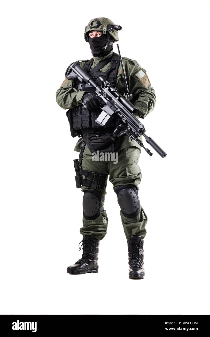 A SWAT officer standing confidently, equipped with tactical gear and ...