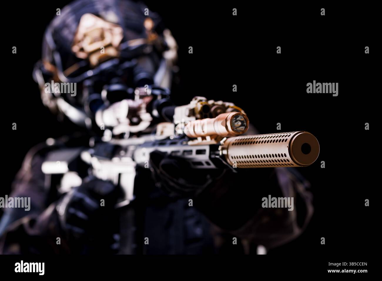 A detailed close-up view of a modern tactical rifle equipped with ...