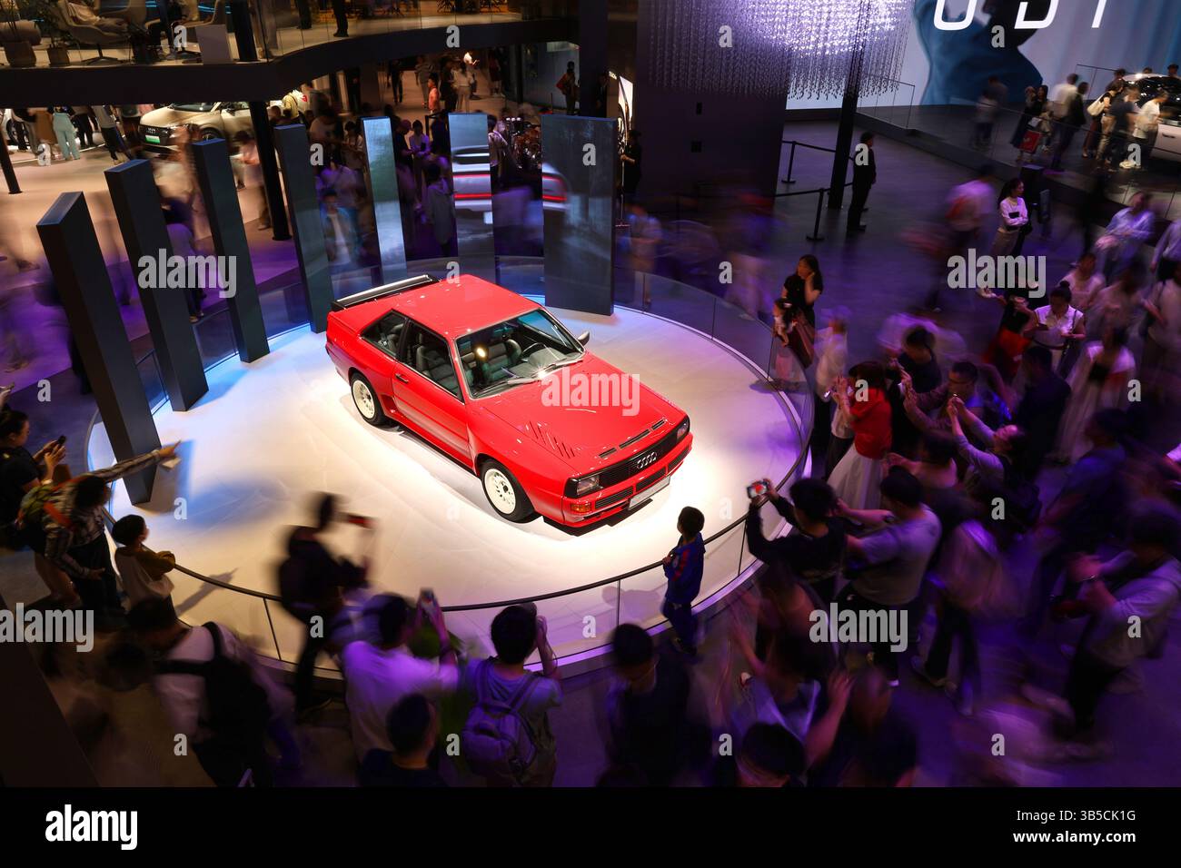 Beijing, China. 1st May, 2025. Visitors look at an Audi car at the 21st ...