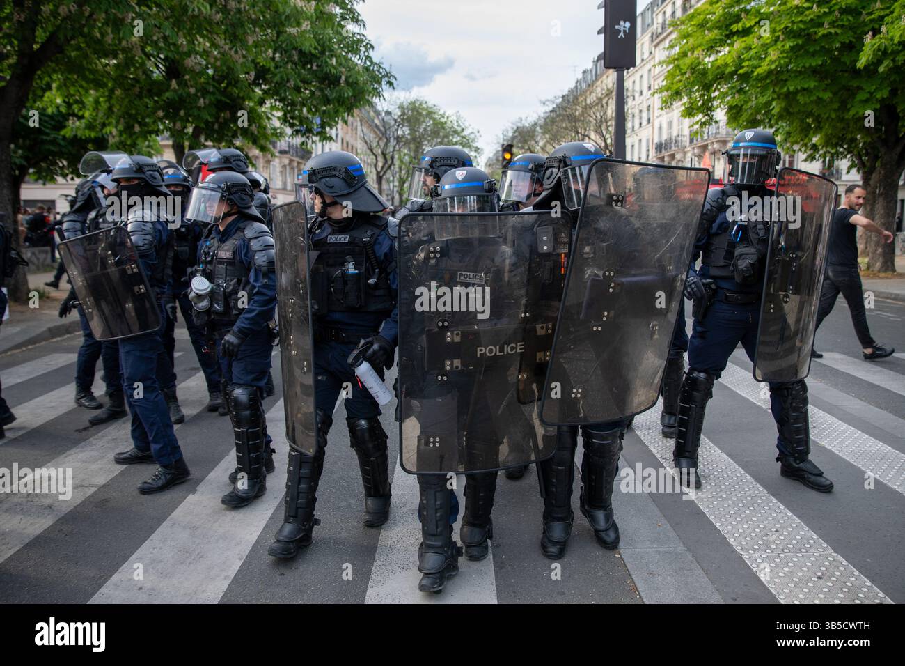 French riot police retreat from a confrontation with protestors during ...