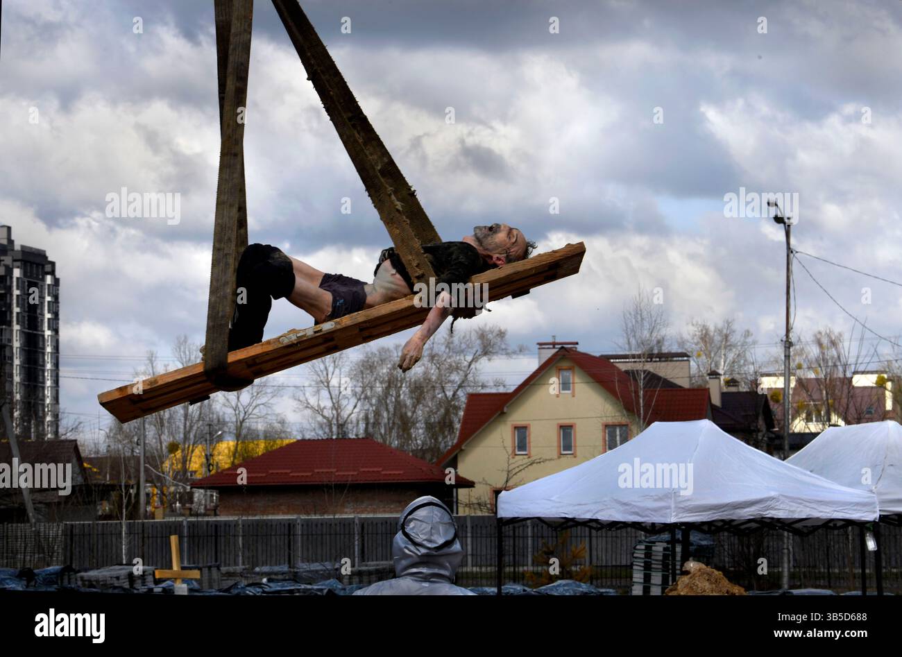 April 11, 2022, Bucha, Kyiv Oblast, Ukraine: A body being pulled from a ...