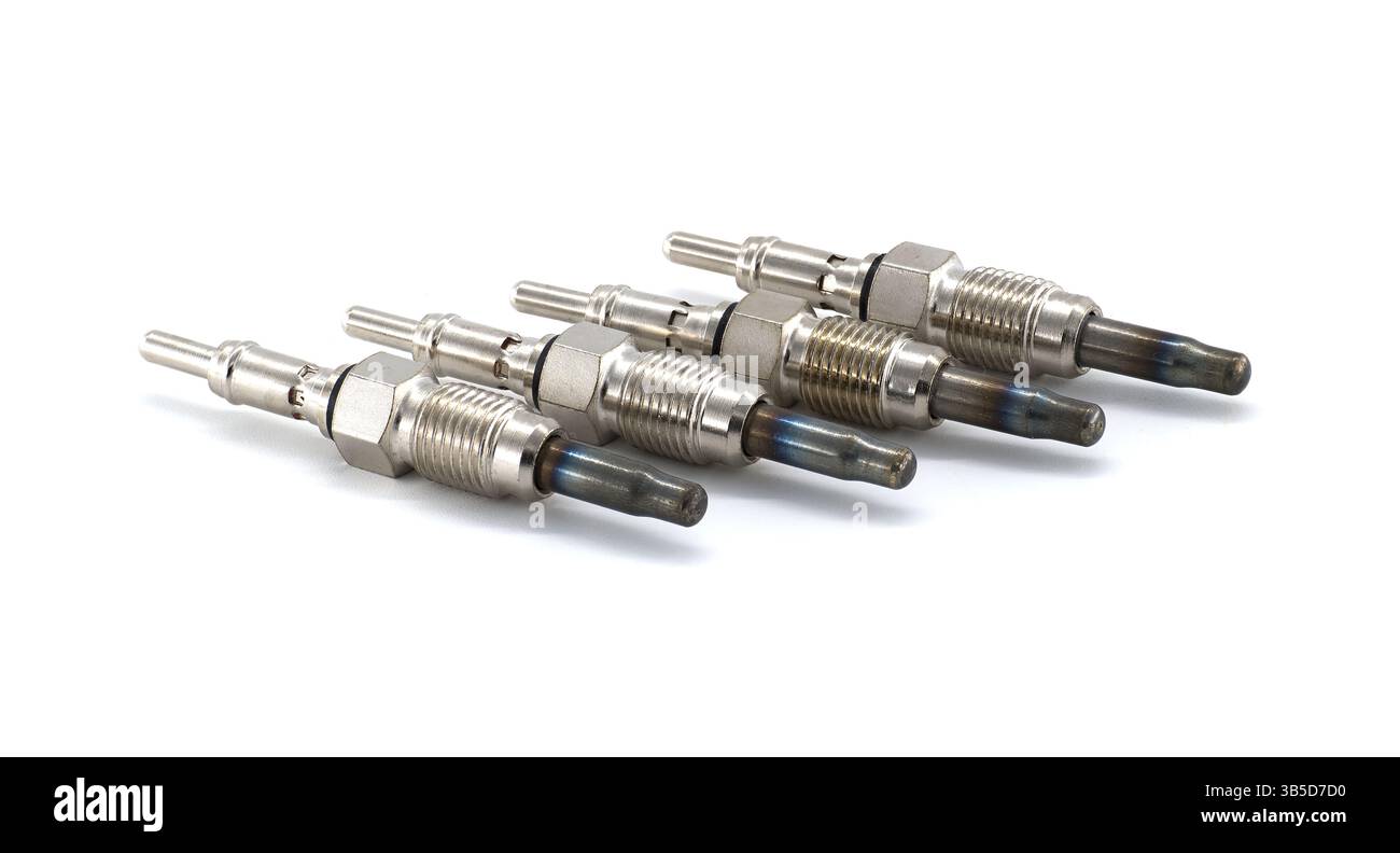 Close-up shot of a set of glow plugs isolated against a white ...