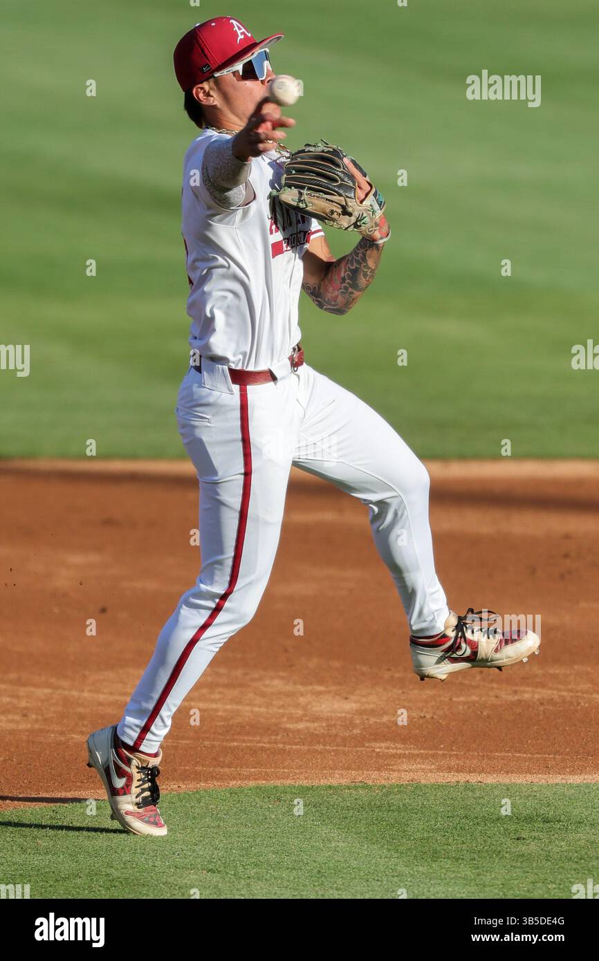 May 1, 2025: Wehiwa Aloy (9) Razorback infielder makes throw across the ...