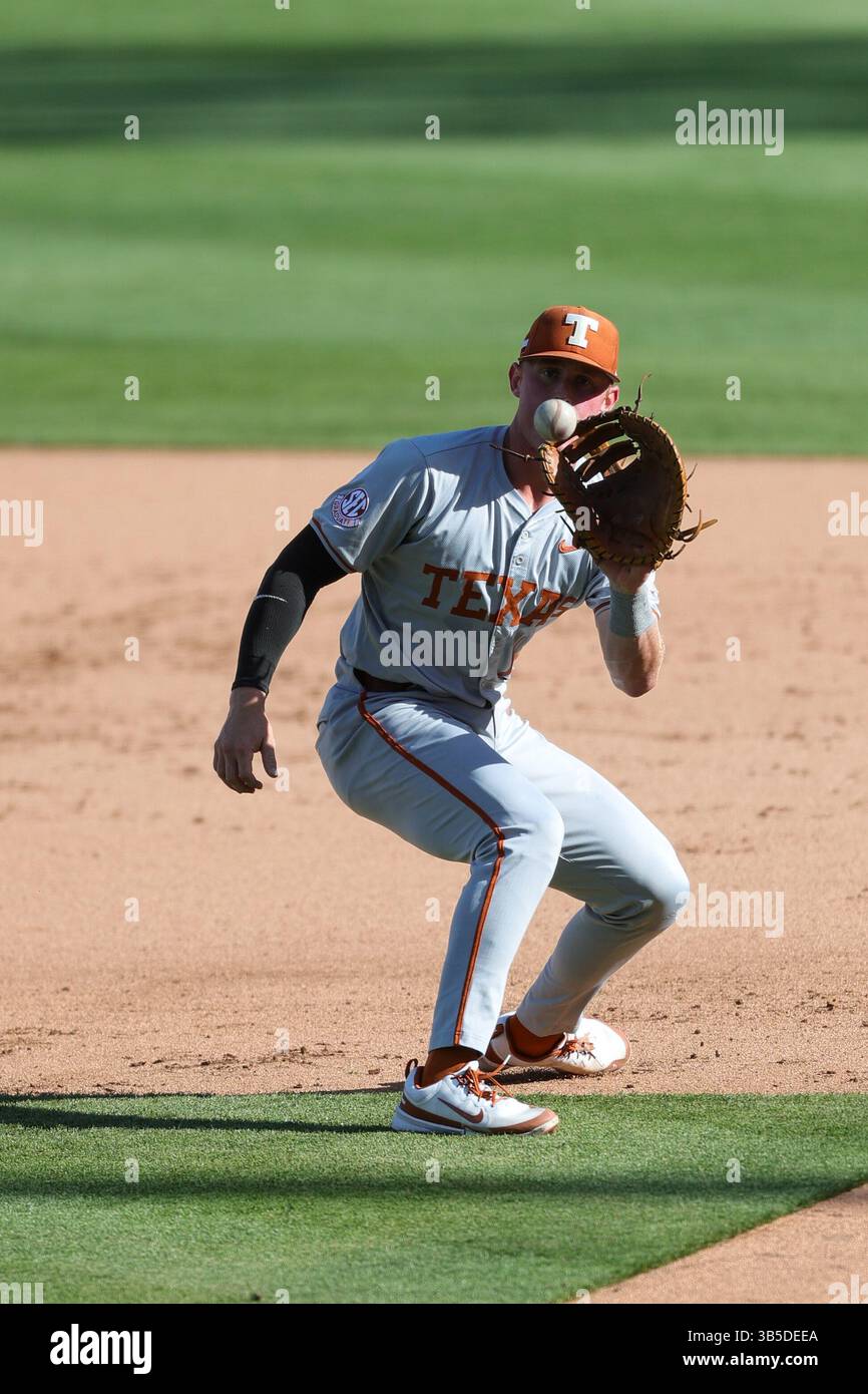 May 1, 2025: Kimble Schuessler (10) Texas first baseman eyes a bounding ...