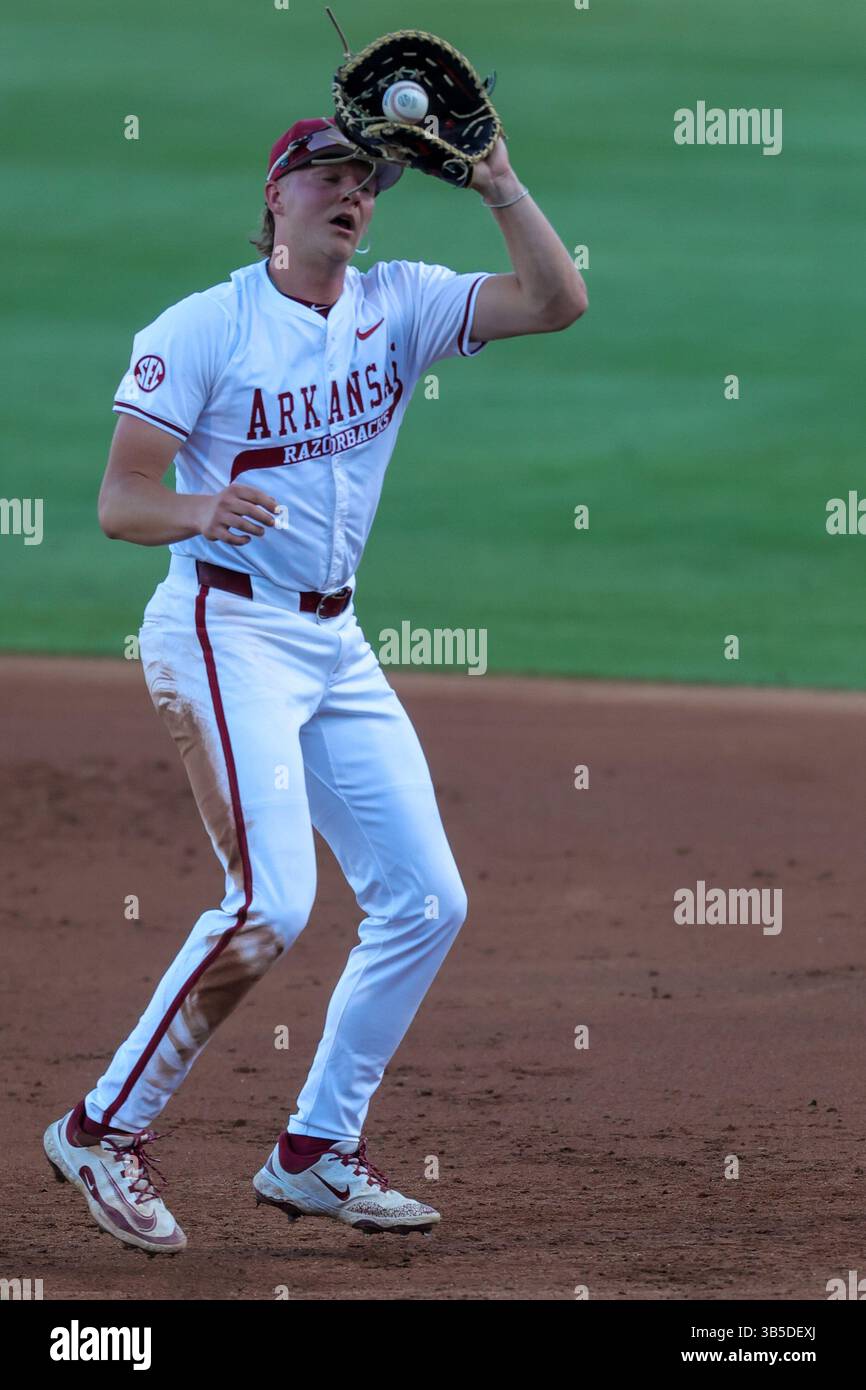 May 1, 2025: Arkansas first baseman Reese Robinett (18) raises his ...