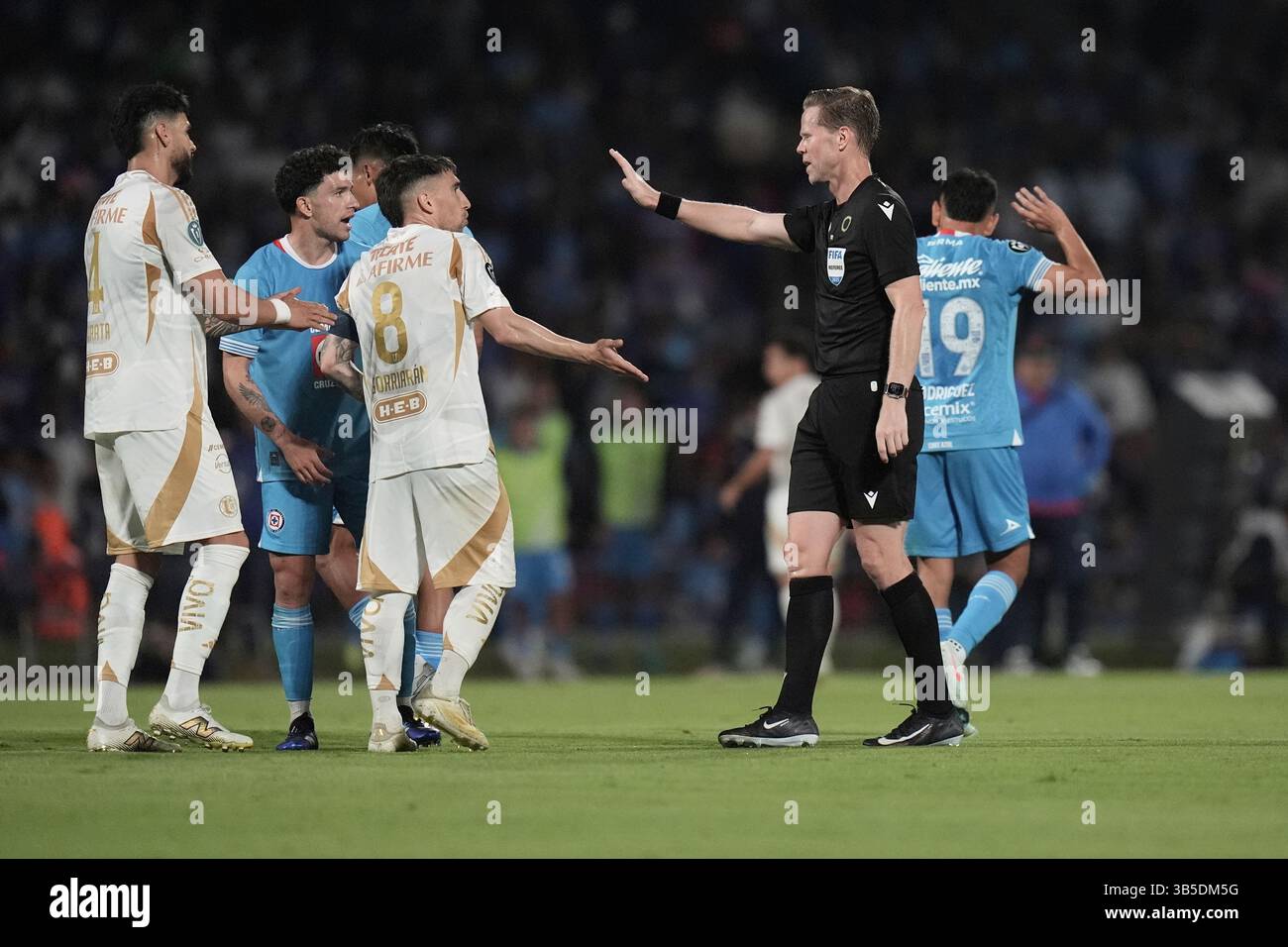 Players of Mexico's Cruz Azul and Mexico's Tigres protest to referee ...