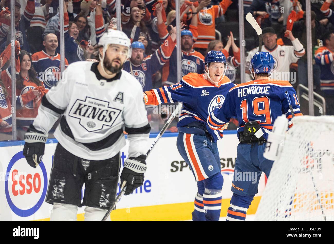 Edmonton Oilers' Trent Frederic (21) and Adam Henrique (19) celebrate a ...