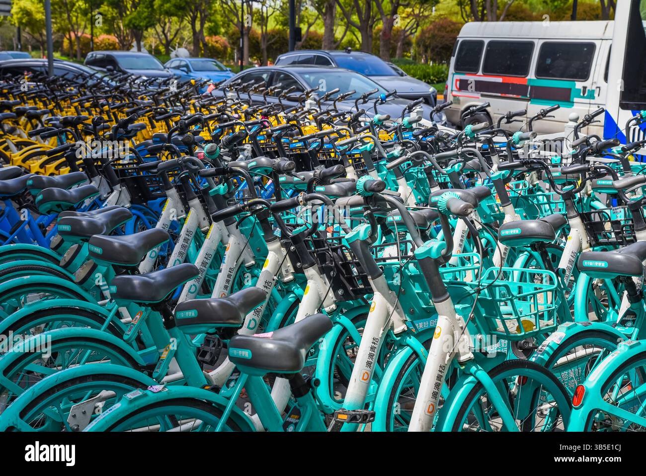 Shanghai, China - 1 April 2025: Blue rental bikes parked in urban area ...