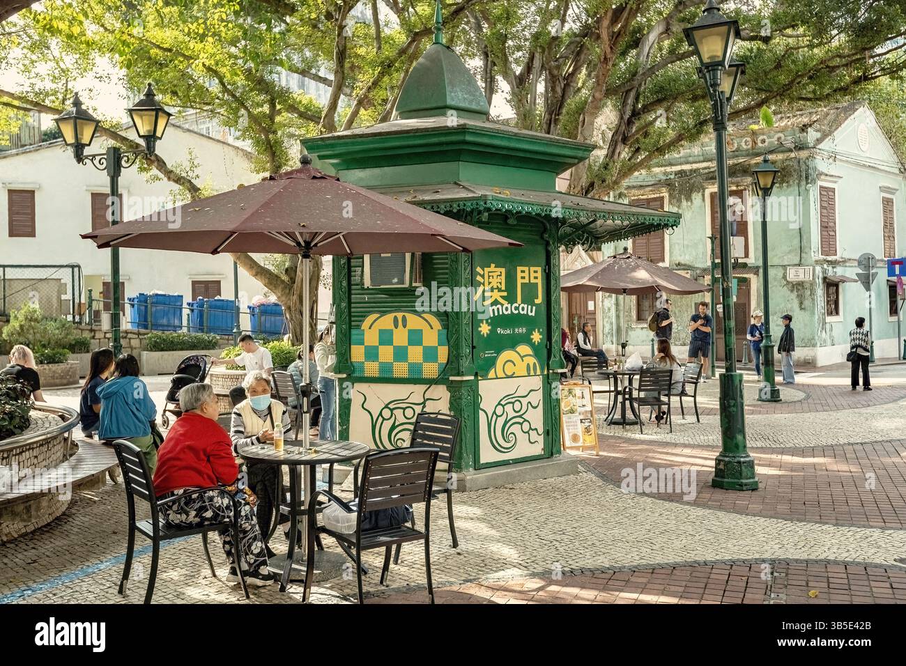 Portuguese style small square and a coffee shop in Macau old town ...