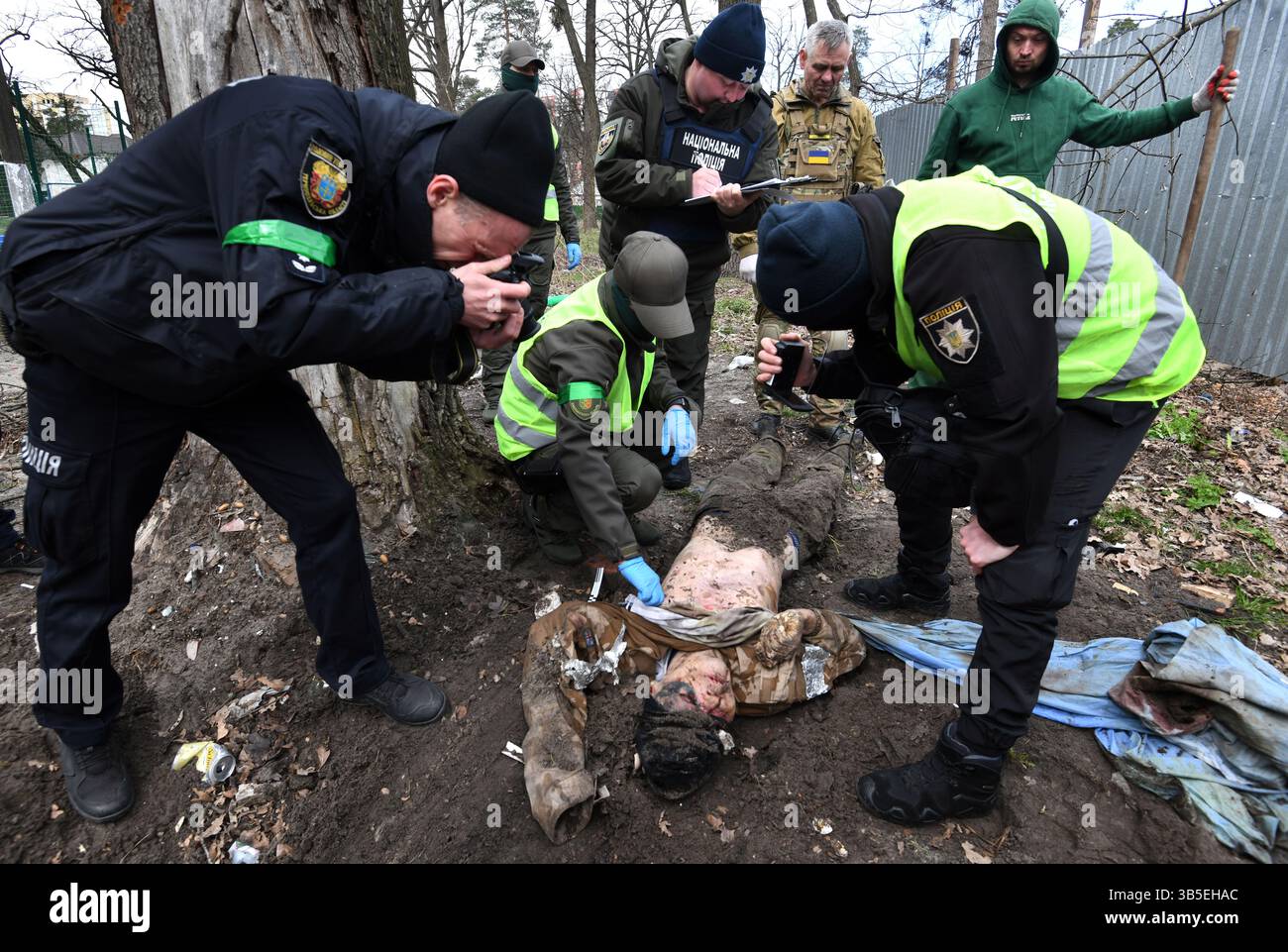 April 14, 2022, Bucha, Ukraine: Police work with local residents and ...