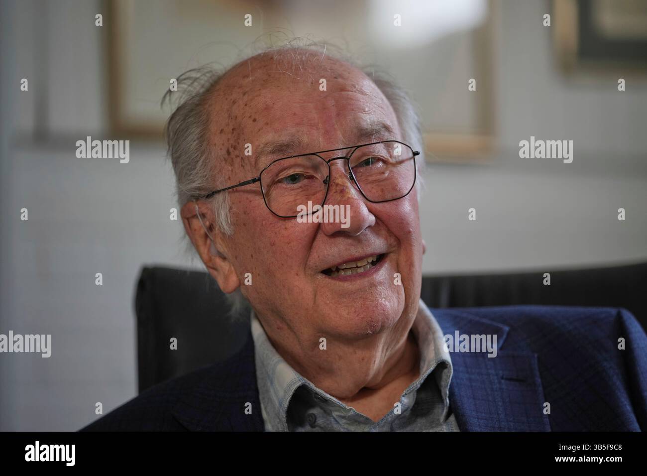 John Goldsmith, 94, draws during an interview at his home in London ...