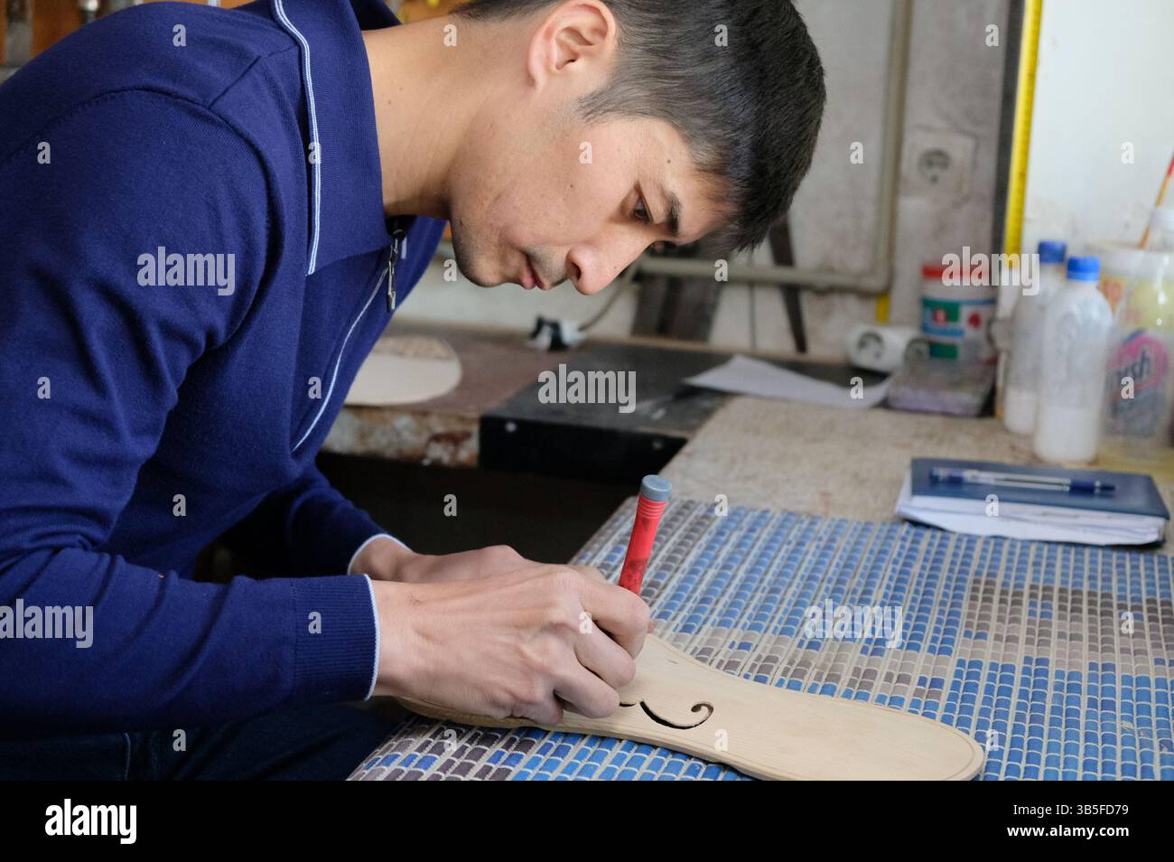 Production of various musical instruments in the workshop Stock Photo ...