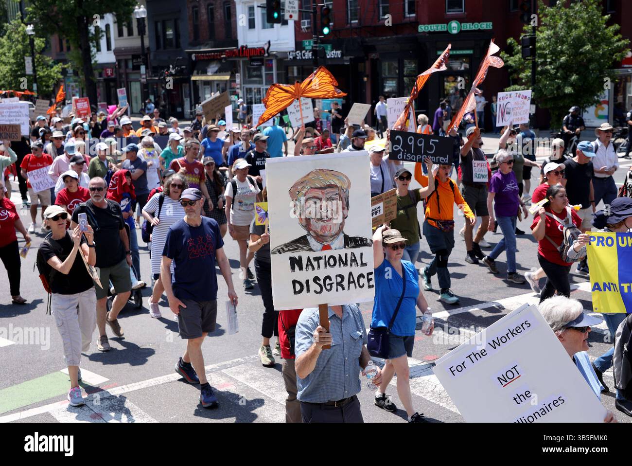 May Day Protest in Washington, USA Demonstrators hold signs as they ...