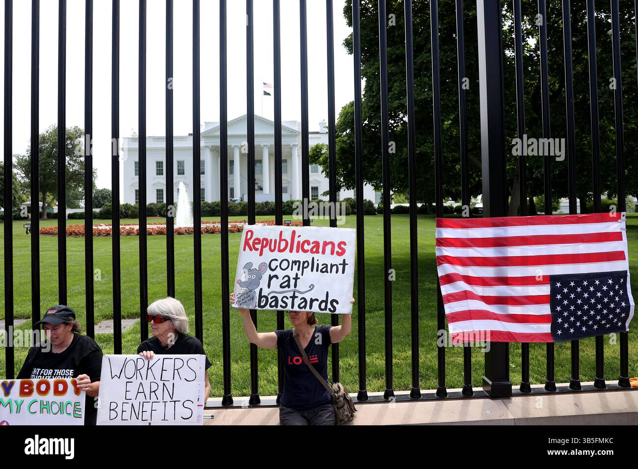 May Day Protest in Washington, USA Demonstrators hold signs and an ...