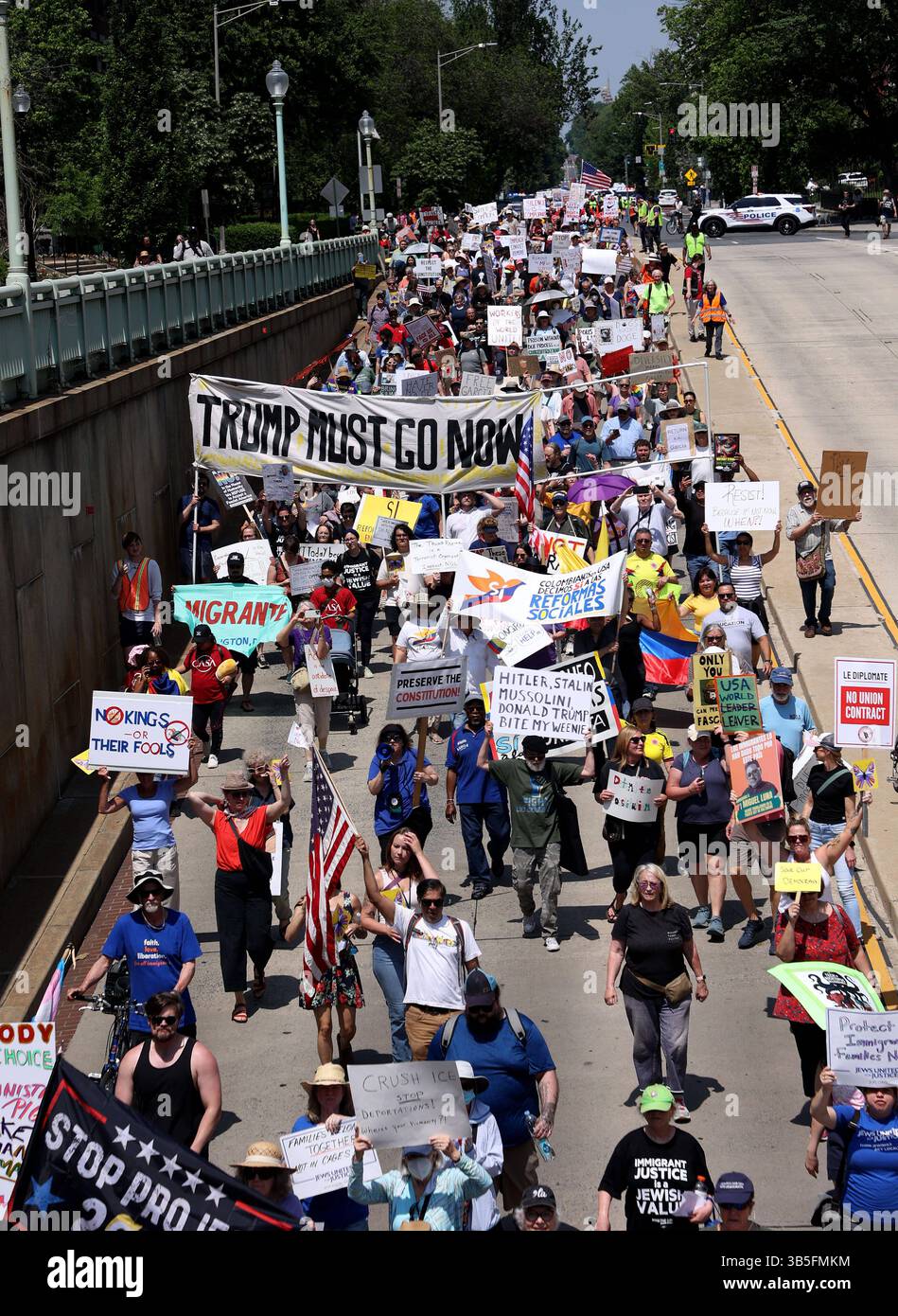 May Day Protest in Washington, USA Demonstrators hold signs as they ...