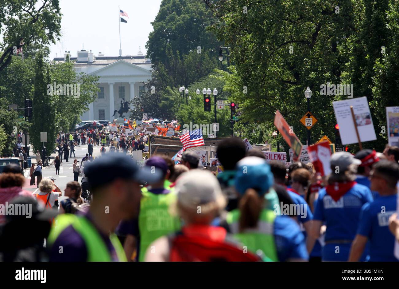 May Day Protest in Washington, USA Demonstrators hold signs as they ...
