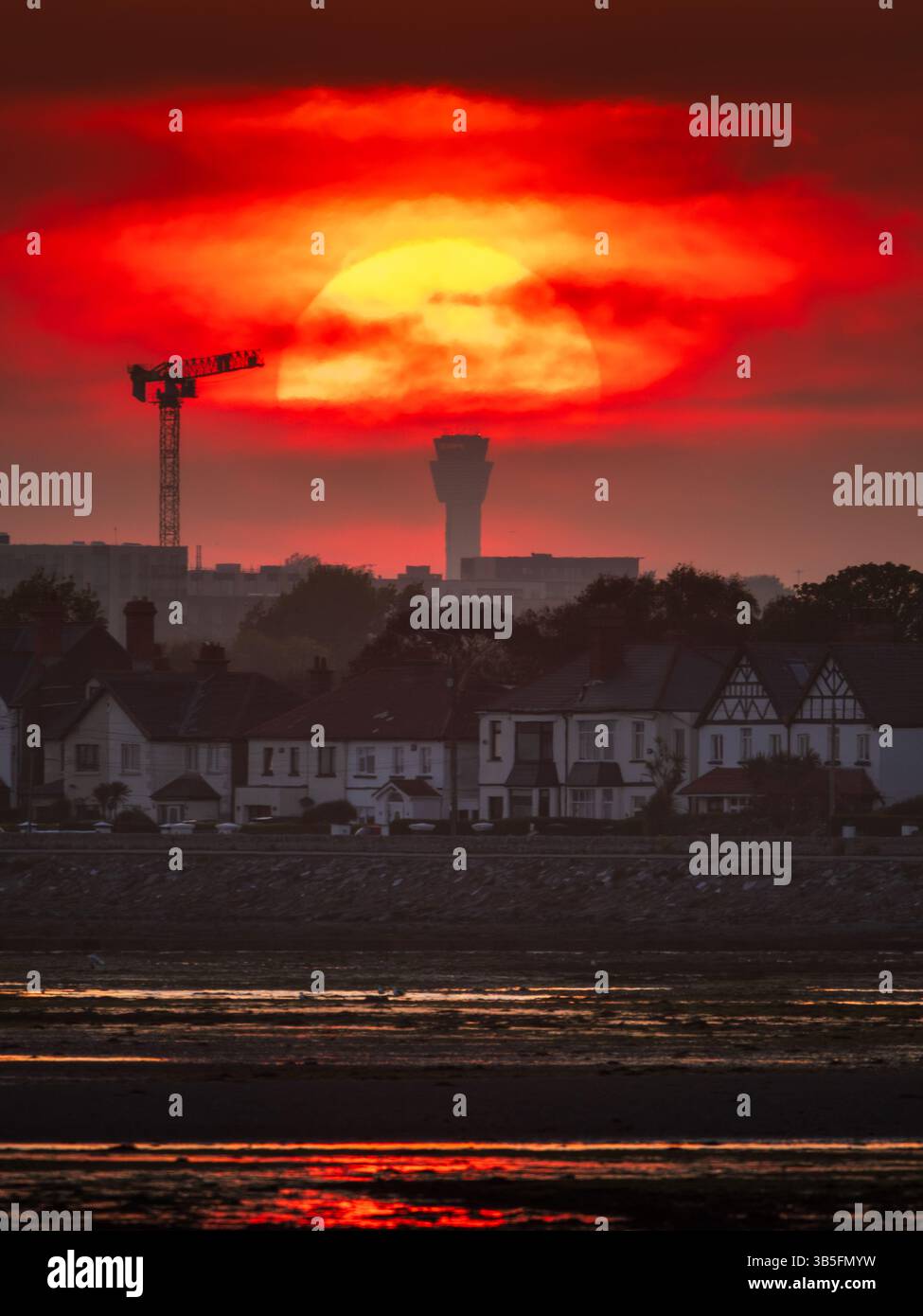 Sunset aligned with Dublin Airport air traffic control tower from ...