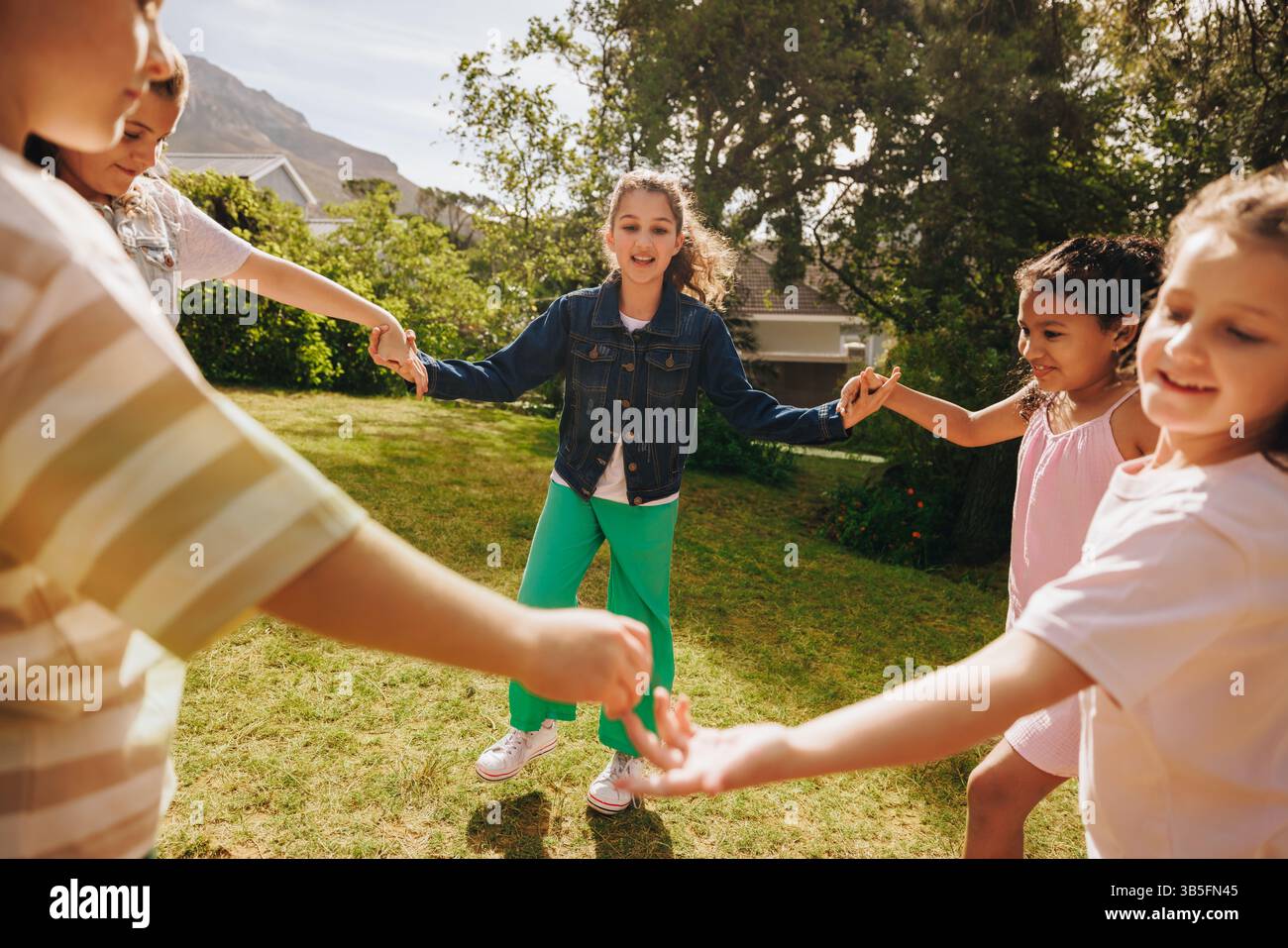 Children playing joyfully under hi-res stock photography and images - Alamy