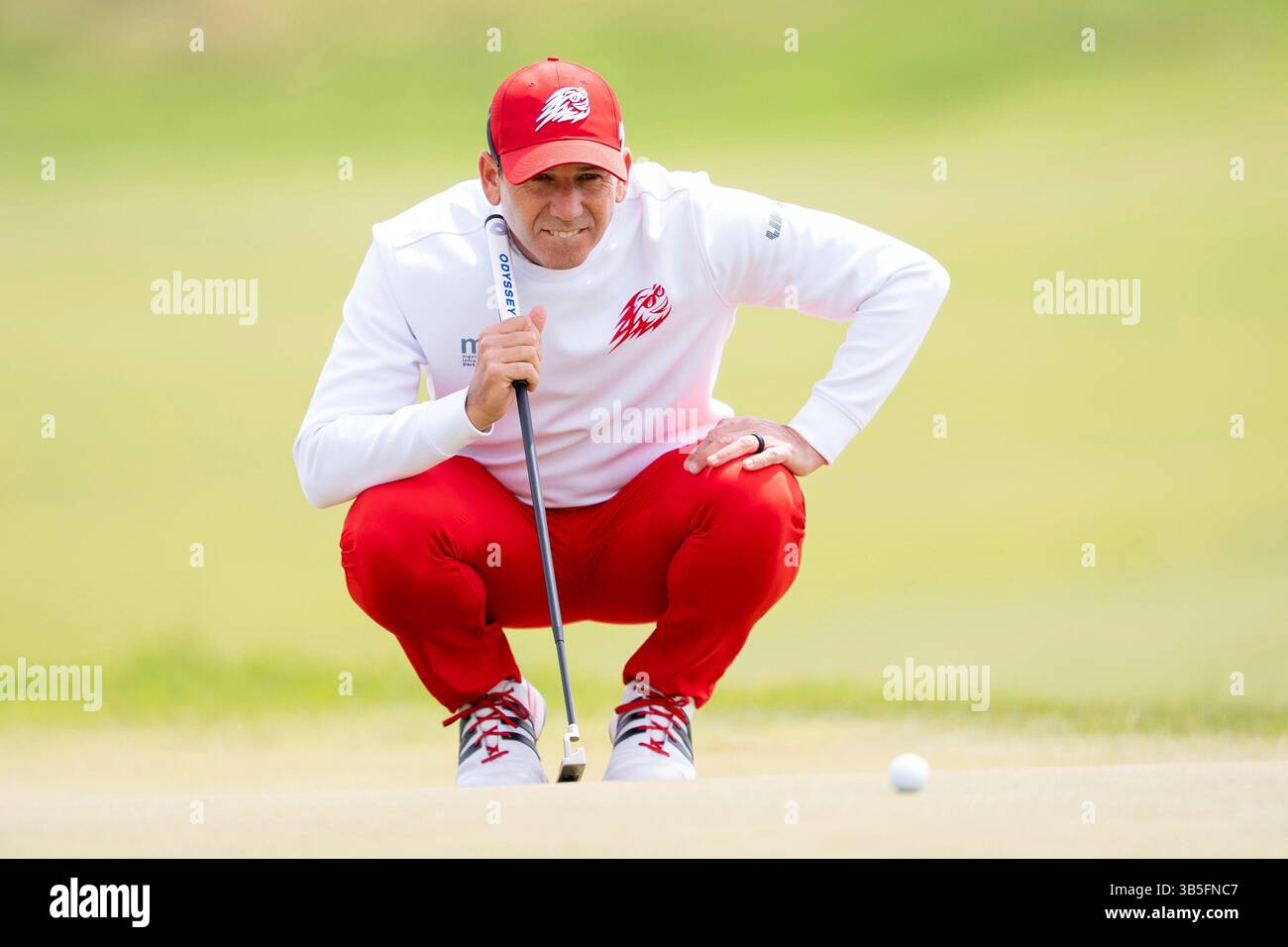 Captain Sergio Garcia of Fireballs GC reads his putt during the first ...