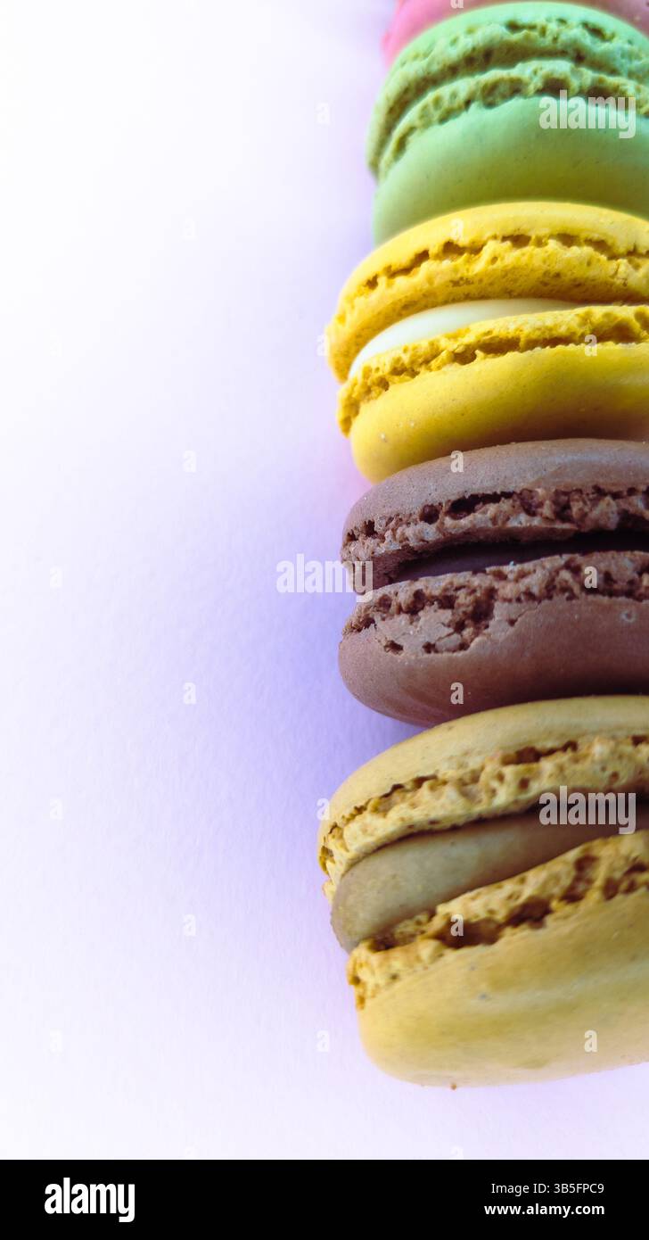 Colorful Assorted French Macarons on Pastel Background Stock Photo - Alamy