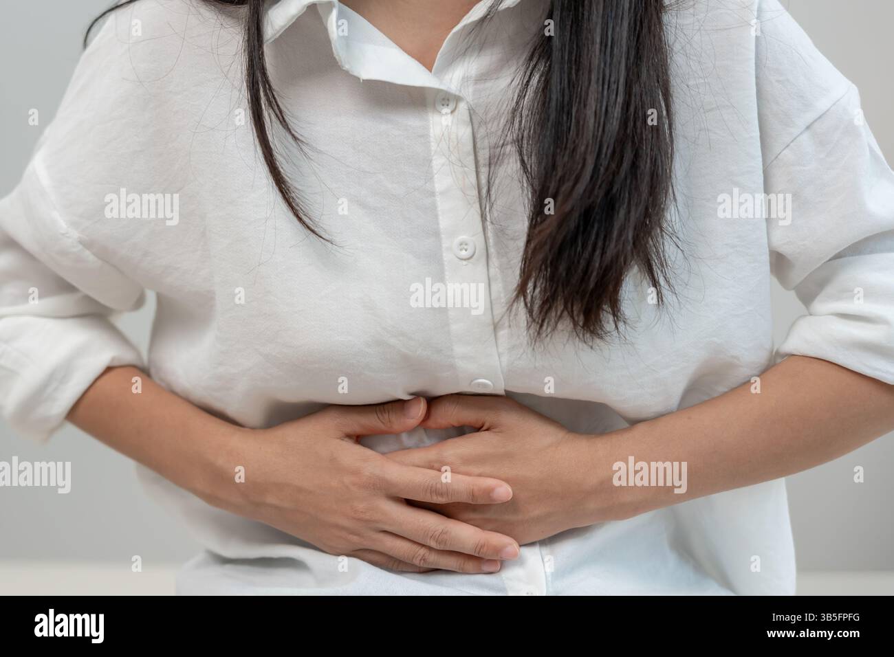 stomach ache. Asian women have abdominal pain, indigestion, gastritis ...