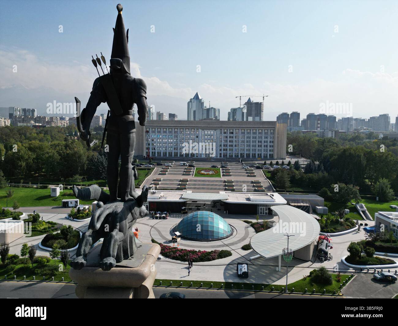 The central square and the monument with the Golden Man Stock Photo - Alamy